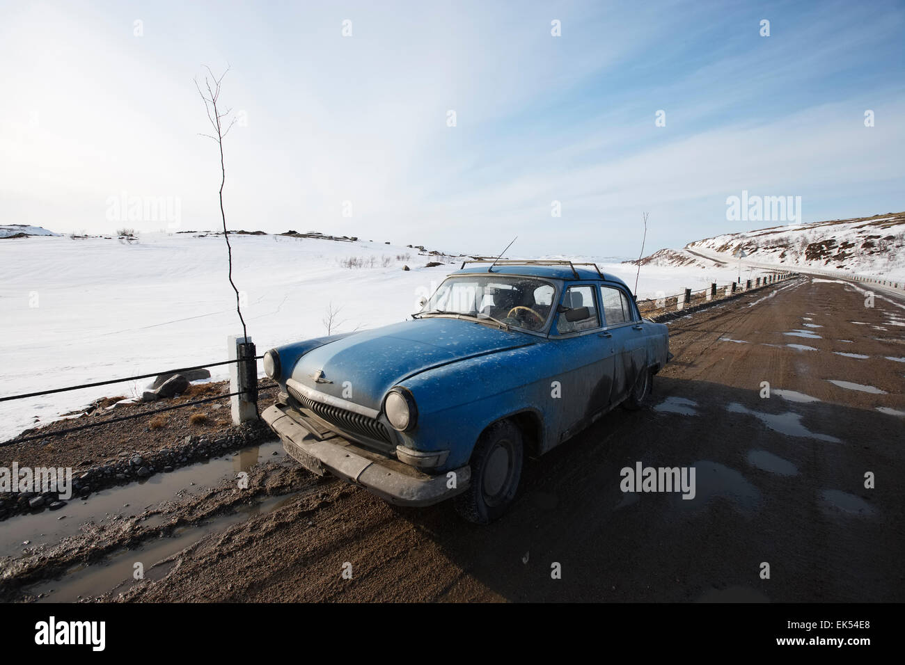Northern Russia road with old model Volga car Stock Photo - Alamy