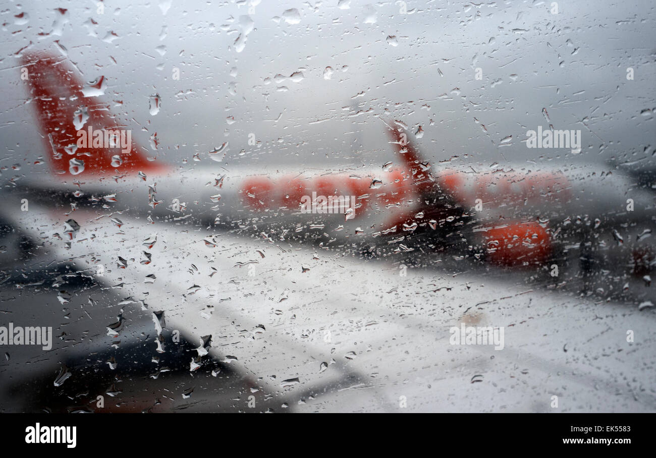 Rain droplets on passenger aircraft window, London Stansted Airport UK ...