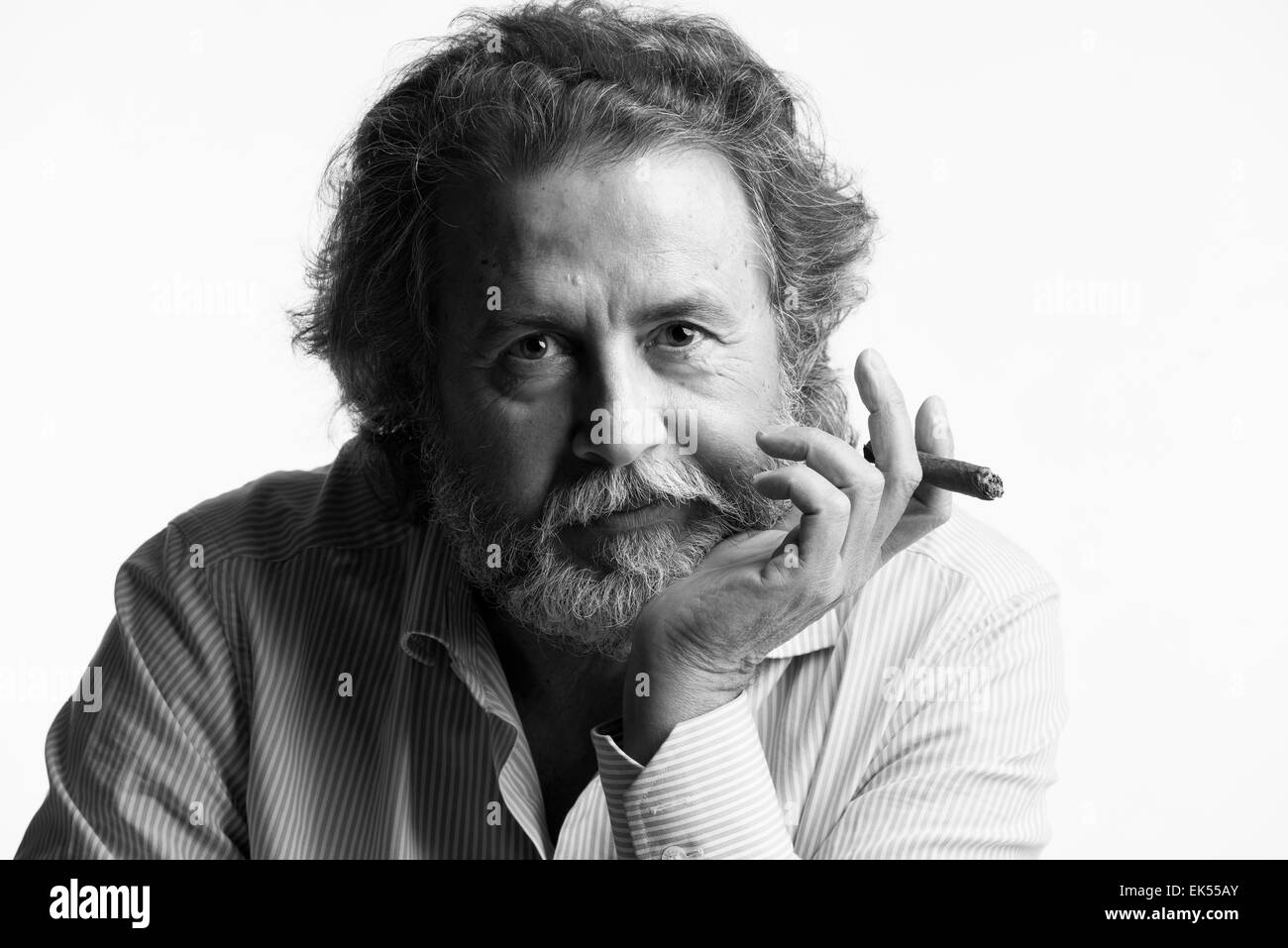 Italy, studio portrait of a bearded middle aged man with a cigar Stock ...