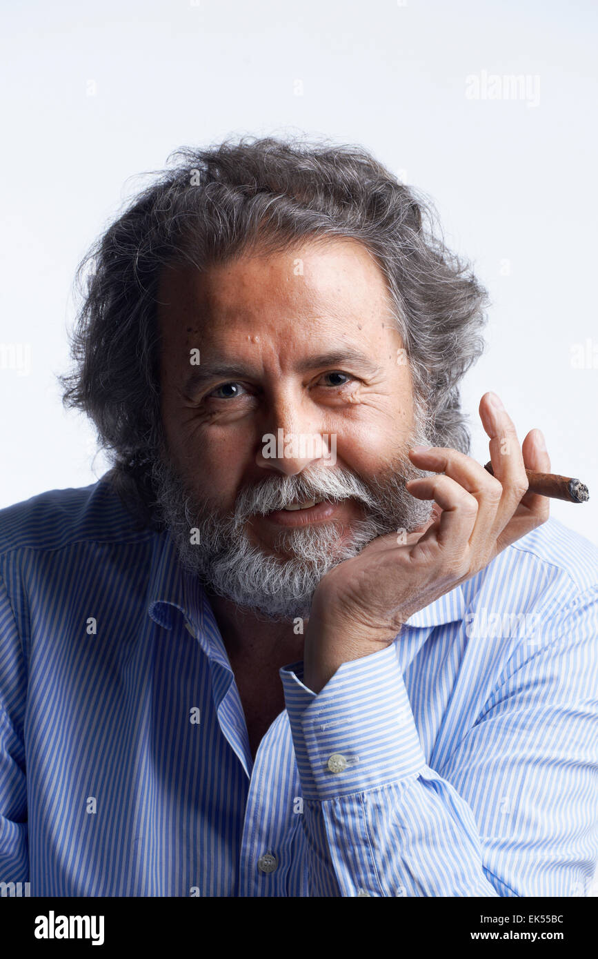 Italy, studio portrait of a bearded middle aged man with a cigar Stock ...