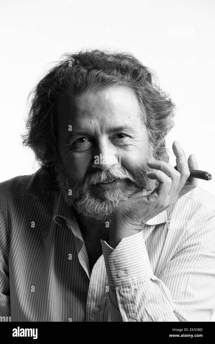 Italy, studio portrait of a bearded middle aged man with a cigar Stock ...