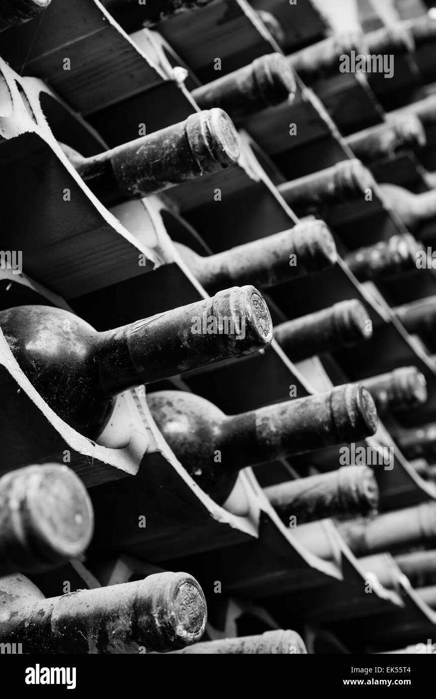 Italy, Sicily, old red wine bottles aging in a wine cellar Stock Photo ...