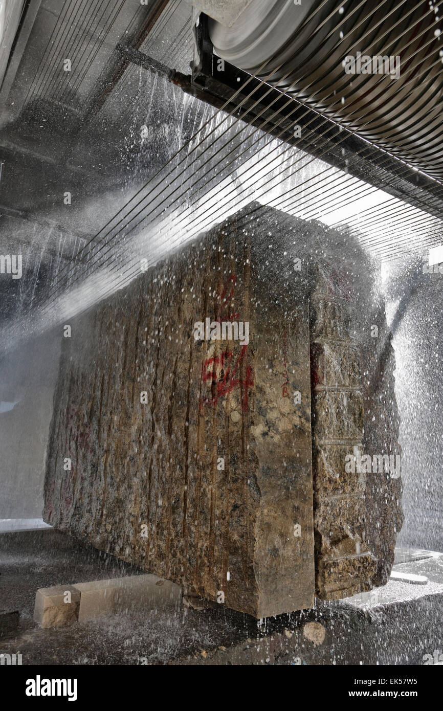 Italy, marble factory, marble cooled with water while being cut ...