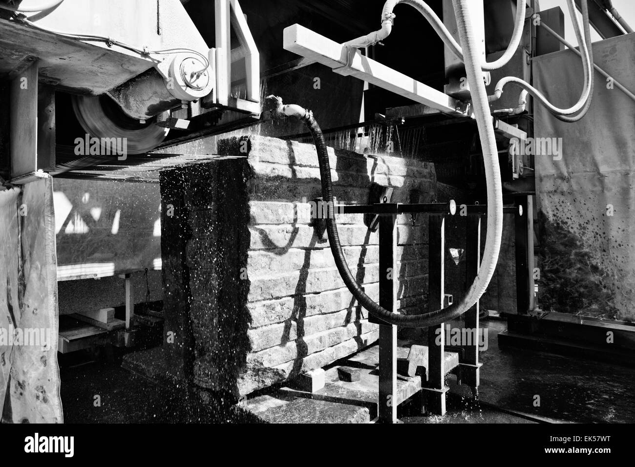 Italy, marble factory, marble cooled with water while being cut ...