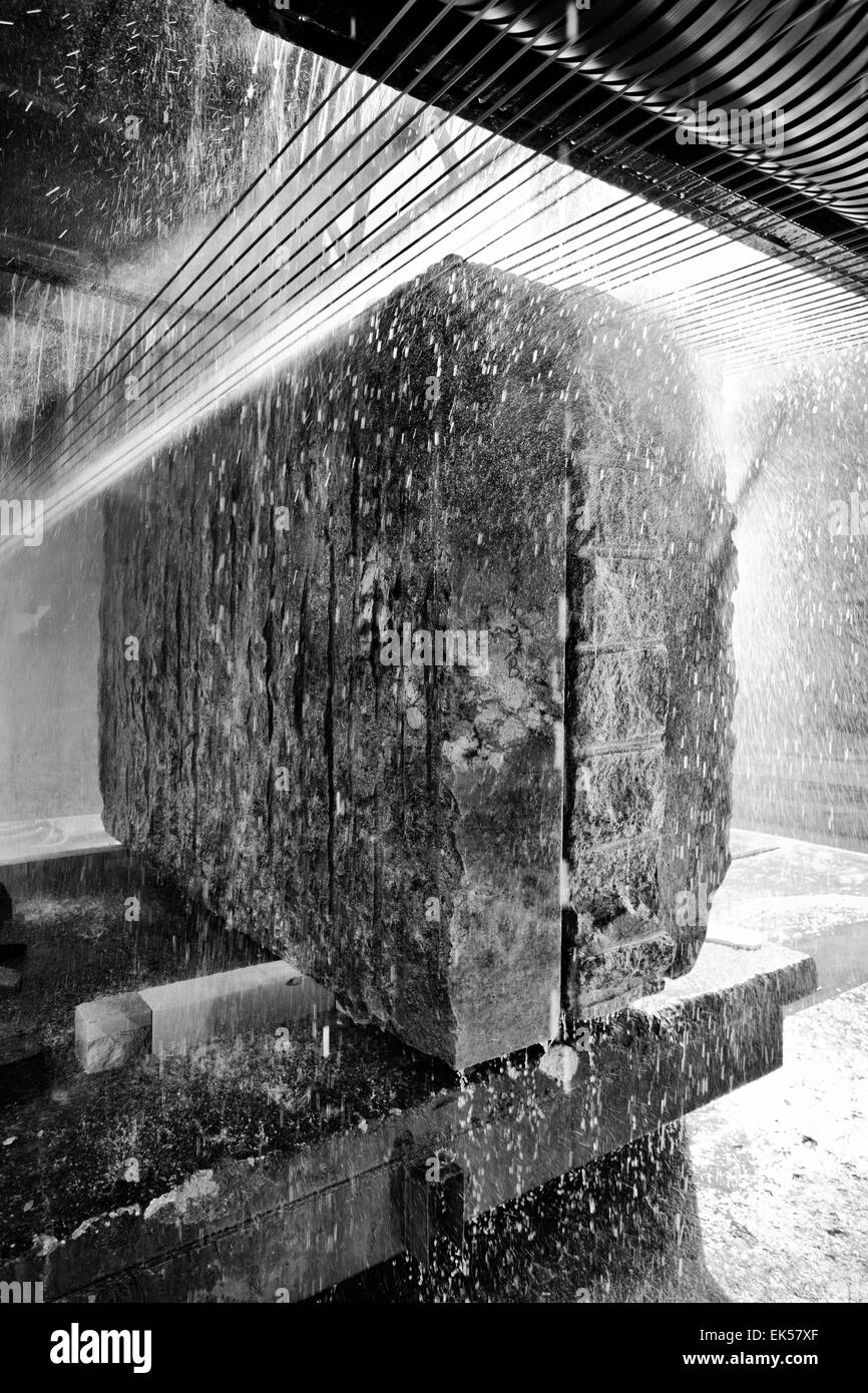 Italy, marble factory, marble cooled with water while being cut ...