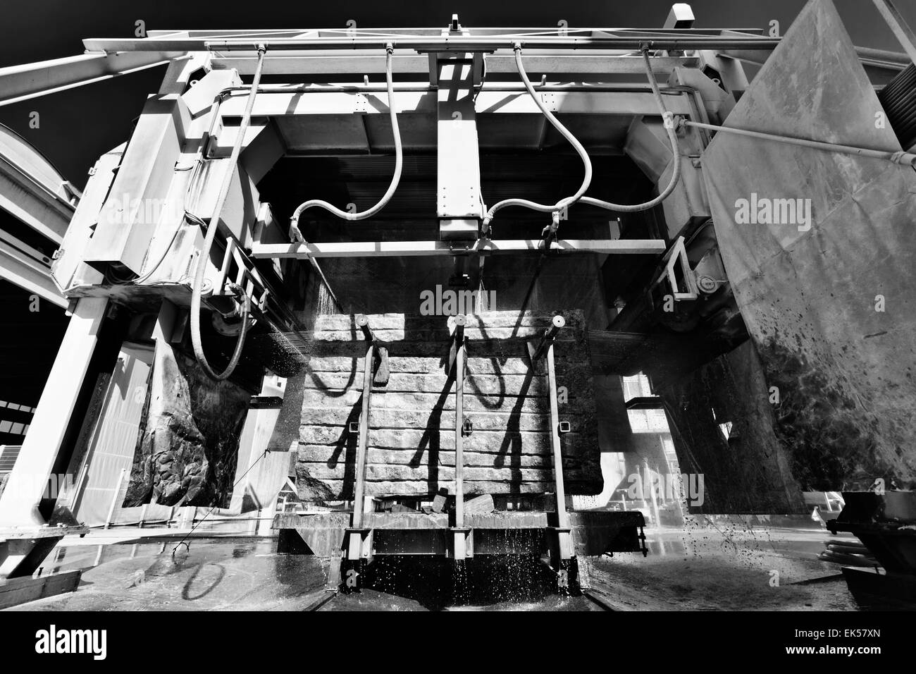 Italy, marble factory, marble cooled with water while being cut ...