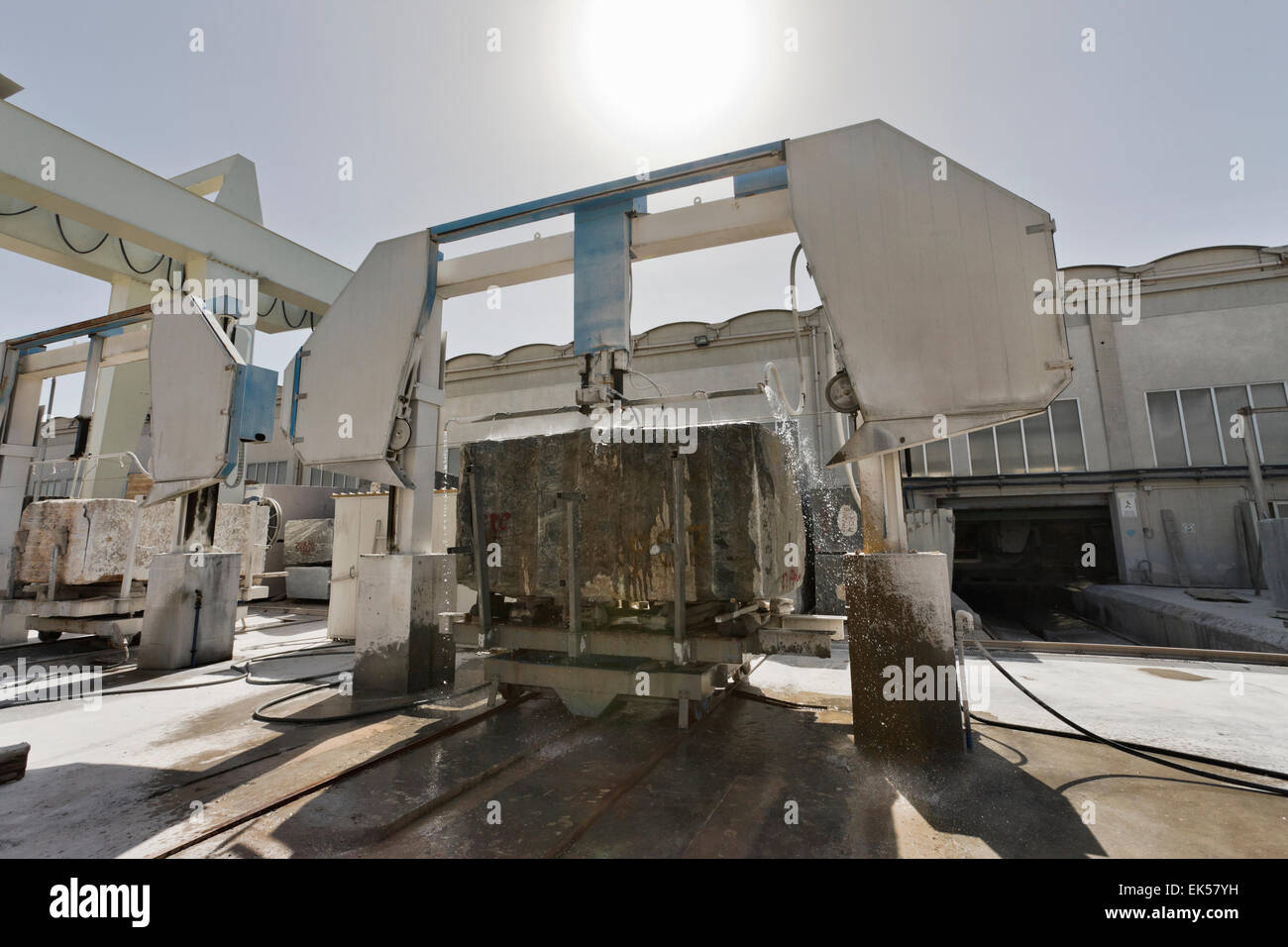 Italy, marble factory, marble cooled with water while being cut ...