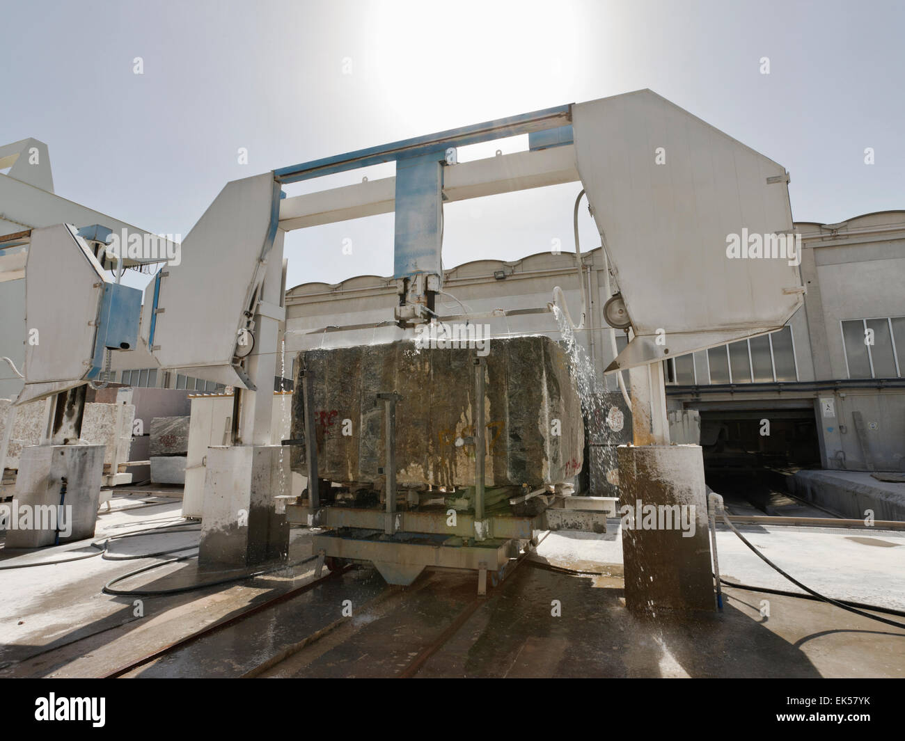 Italy, marble factory, marble cooled with water while being cut ...