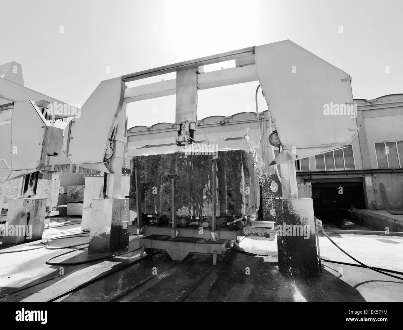 Italy, marble factory, marble cooled with water while being cut ...