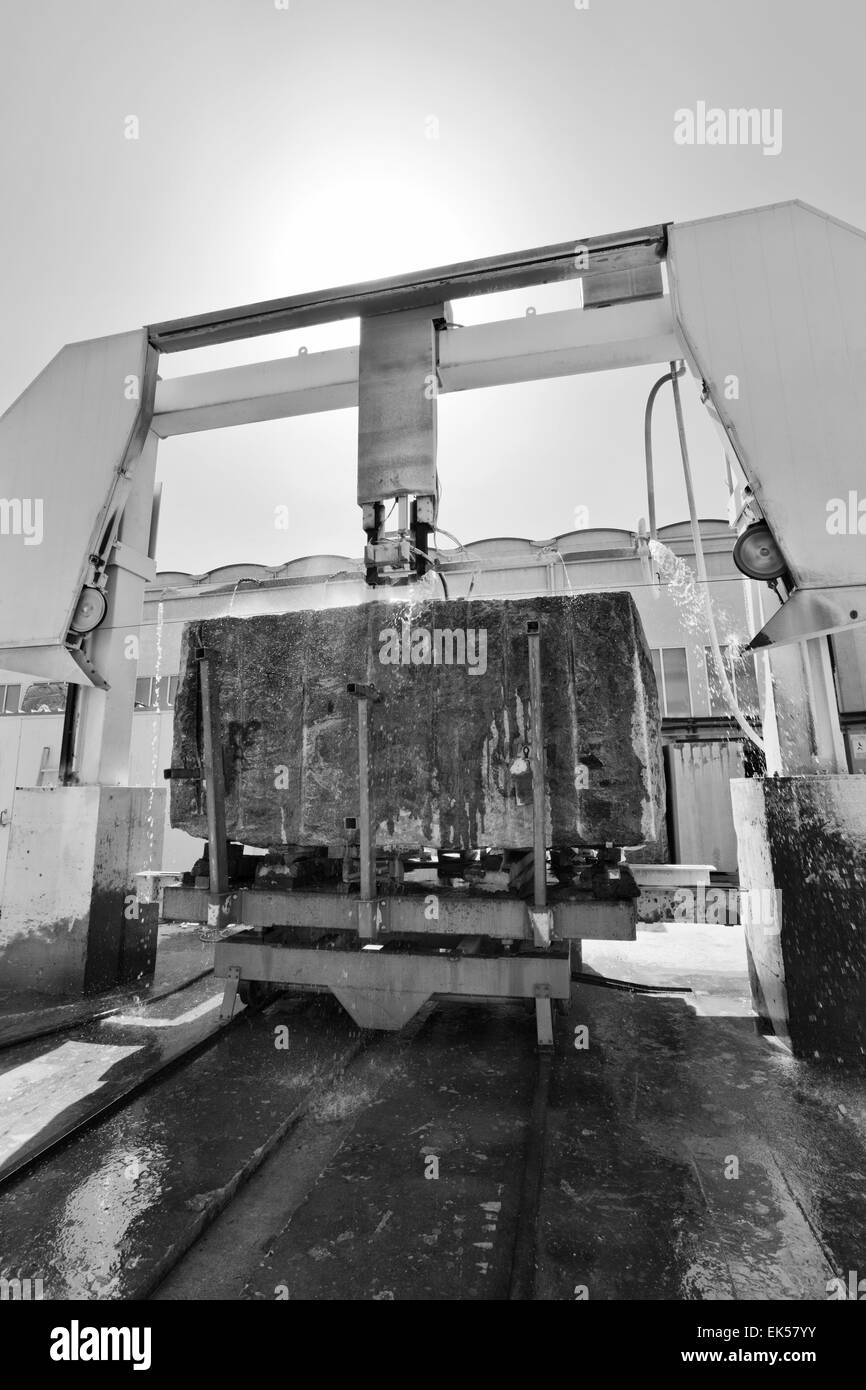 Italy, marble factory, marble cooled with water while being cut ...