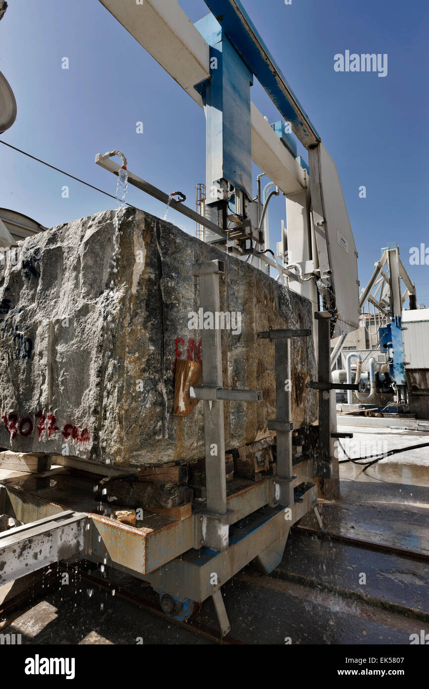 Italy, marble factory, marble cooled with water while being cut ...