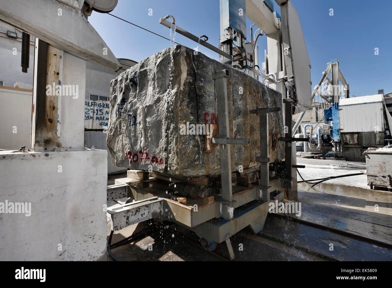 Italy, marble factory, marble cooled with water while being cut ...