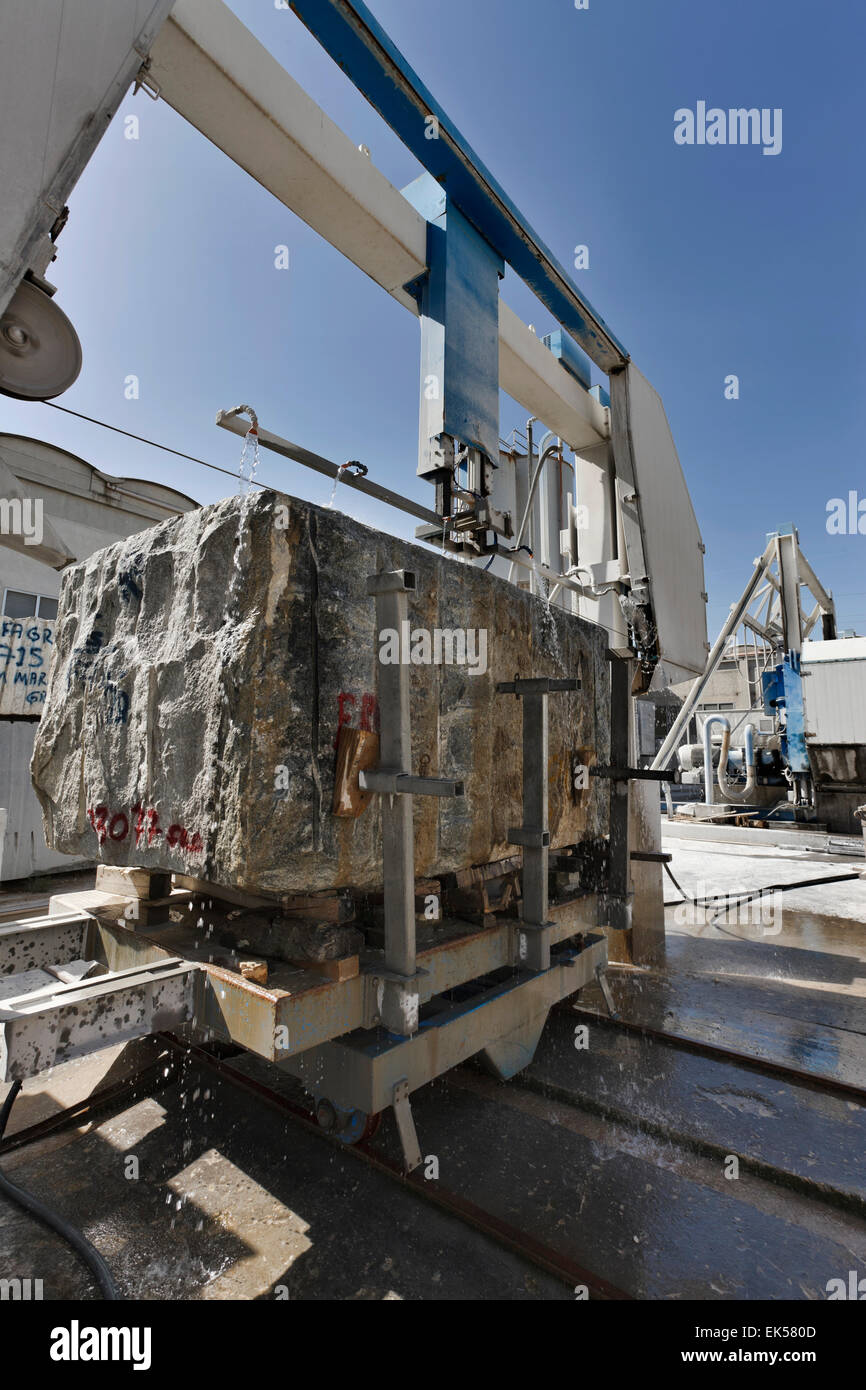 Italy, marble factory, marble cooled with water while being cut ...