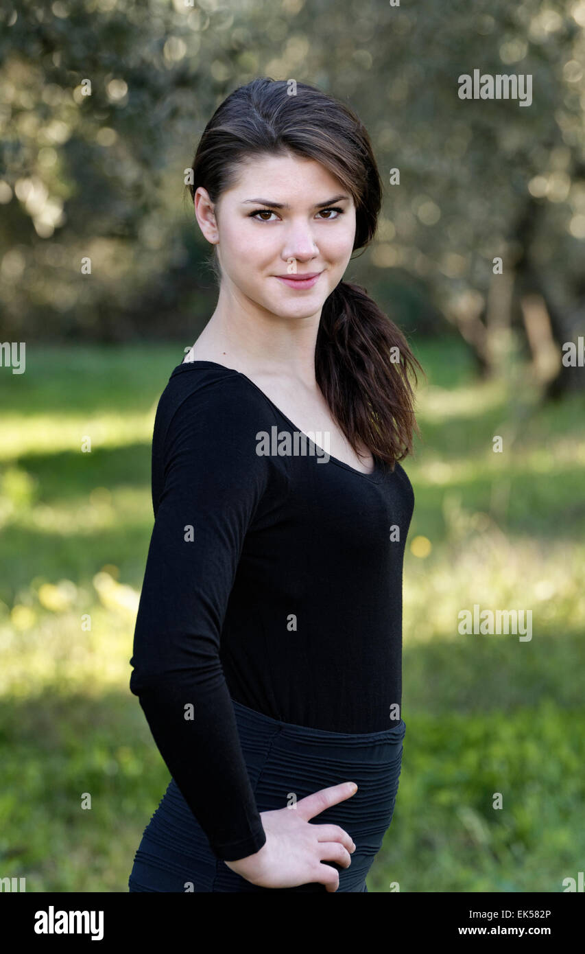 Italy, smiling female teenager portrait Stock Photo - Alamy