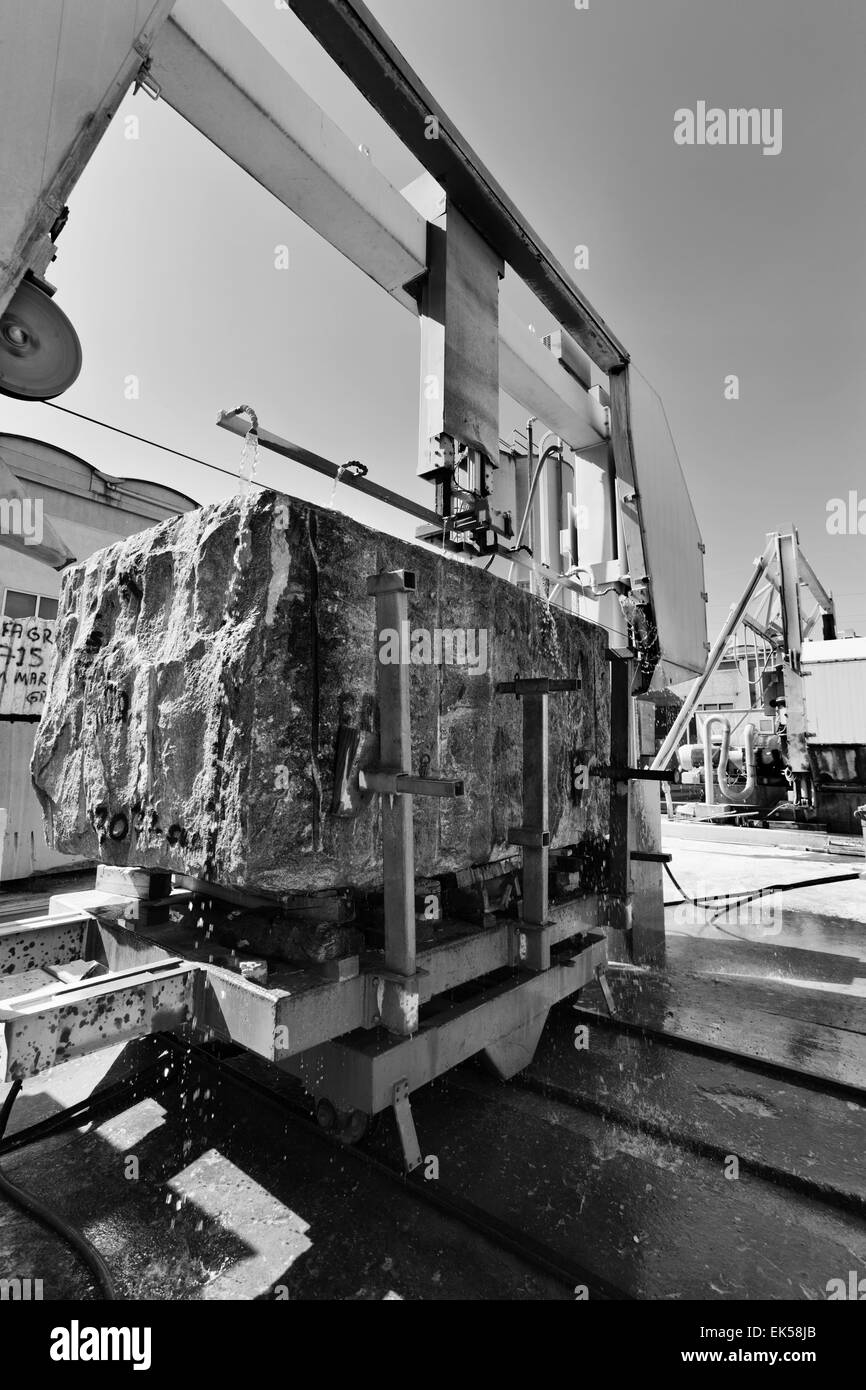 Italy, marble factory, marble cooled with water while being cut ...