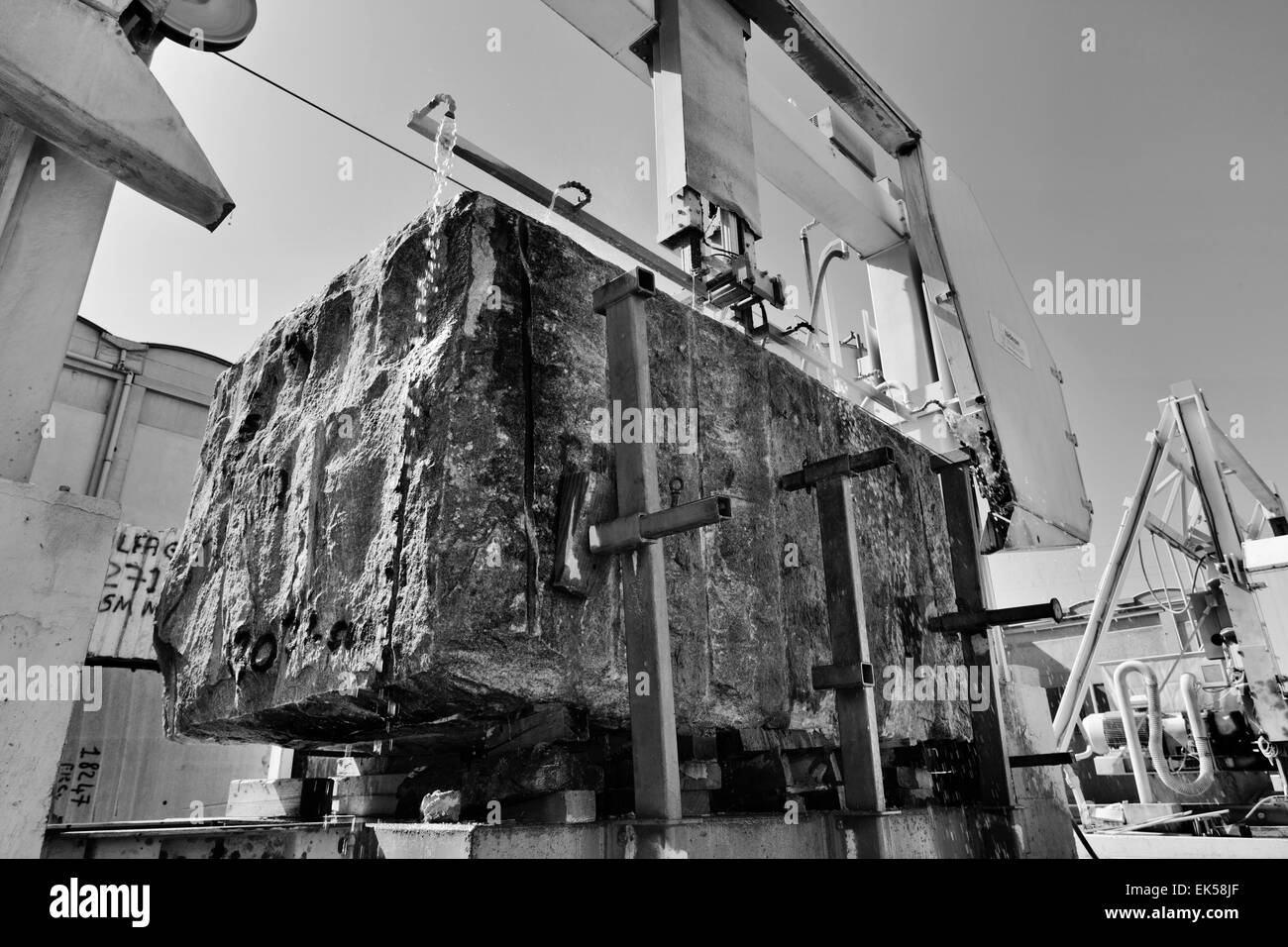 Italy, marble factory, marble cooled with water while being cut ...