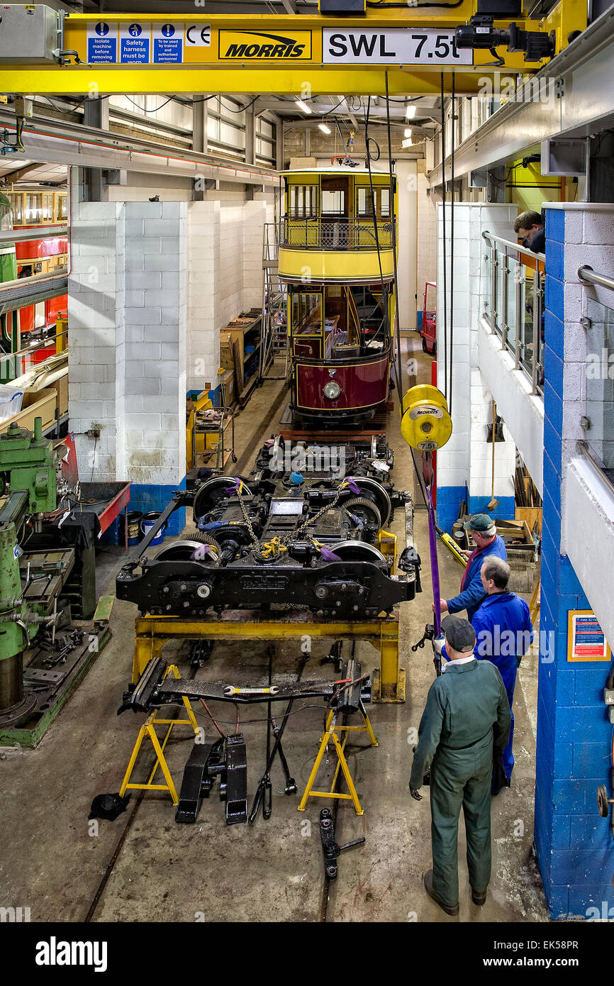 Engineers expertly restore a tram working on an electro-mechanical ...