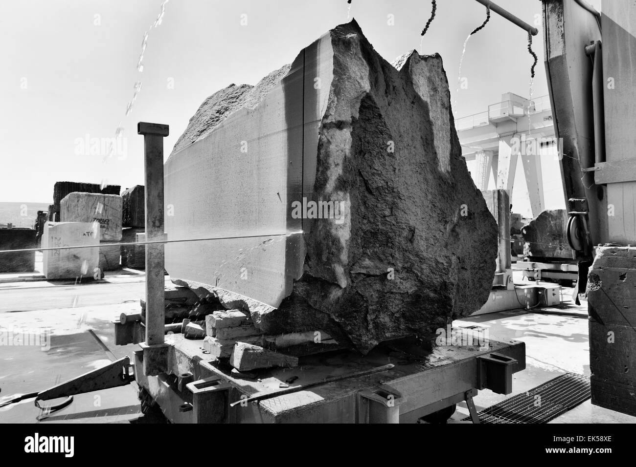 Italy, marble cutting factory, granite block cooled with water while ...