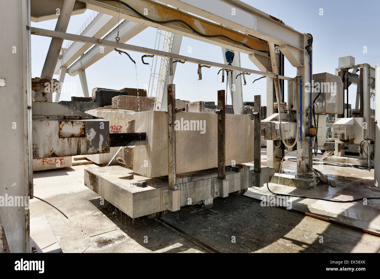 Italy, marble cutting factory, marble block cooled with water while ...