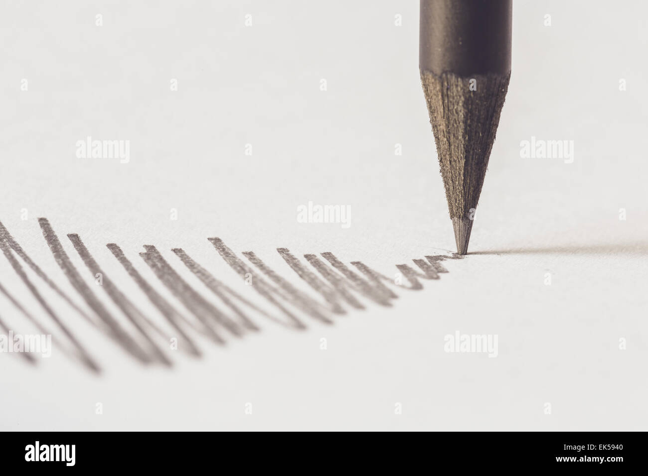 Close up Black pencil with stroke on white paper Stock Photo - Alamy