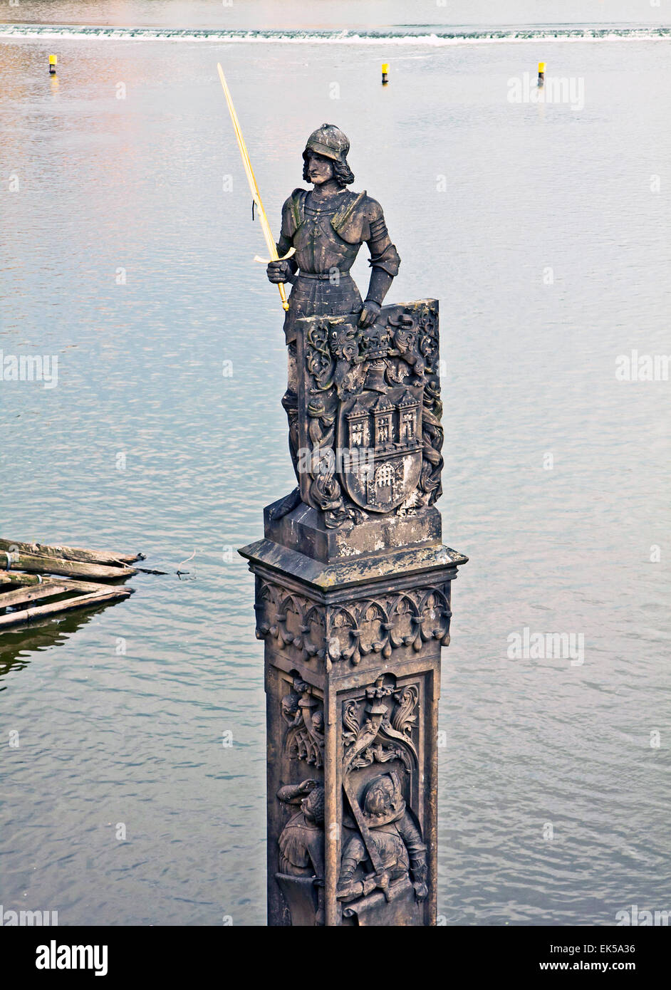 Prague, medieval stone statue of a knight at the foot of Charles Bridge ...