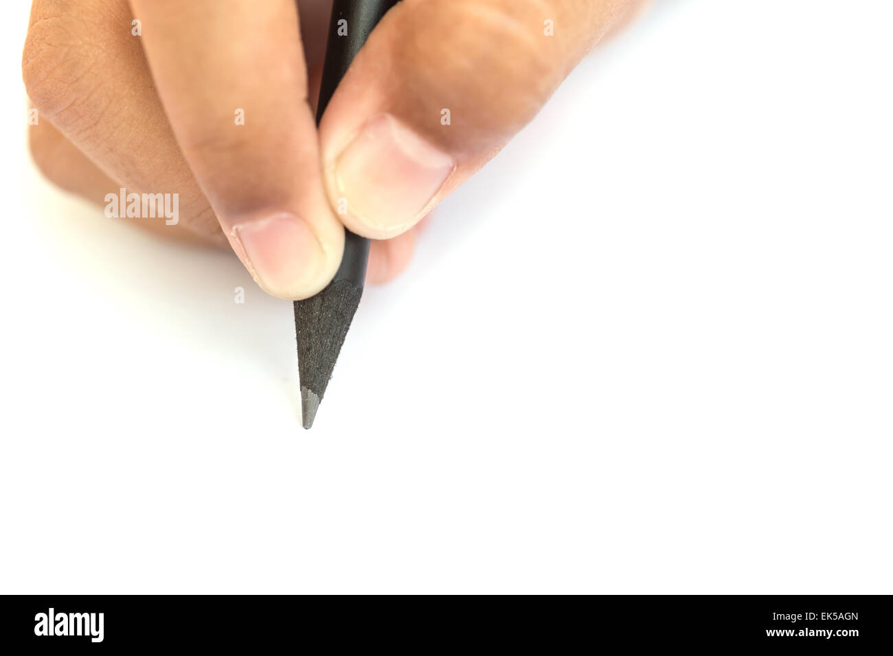 Close up Hand holding black pencil Stock Photo - Alamy