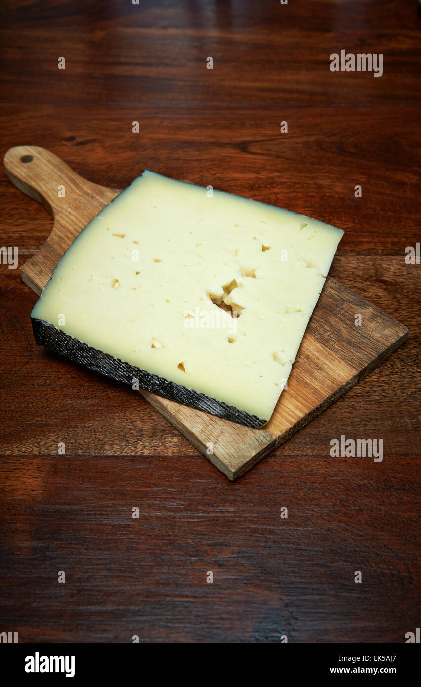 Italy, Asiago italian cheese on a wooden table Stock Photo - Alamy