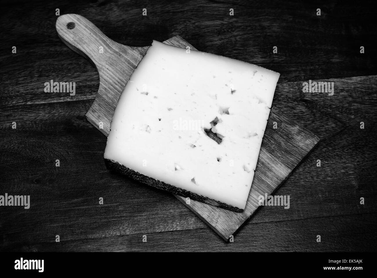 Italy, Asiago italian cheese on a wooden table Stock Photo - Alamy