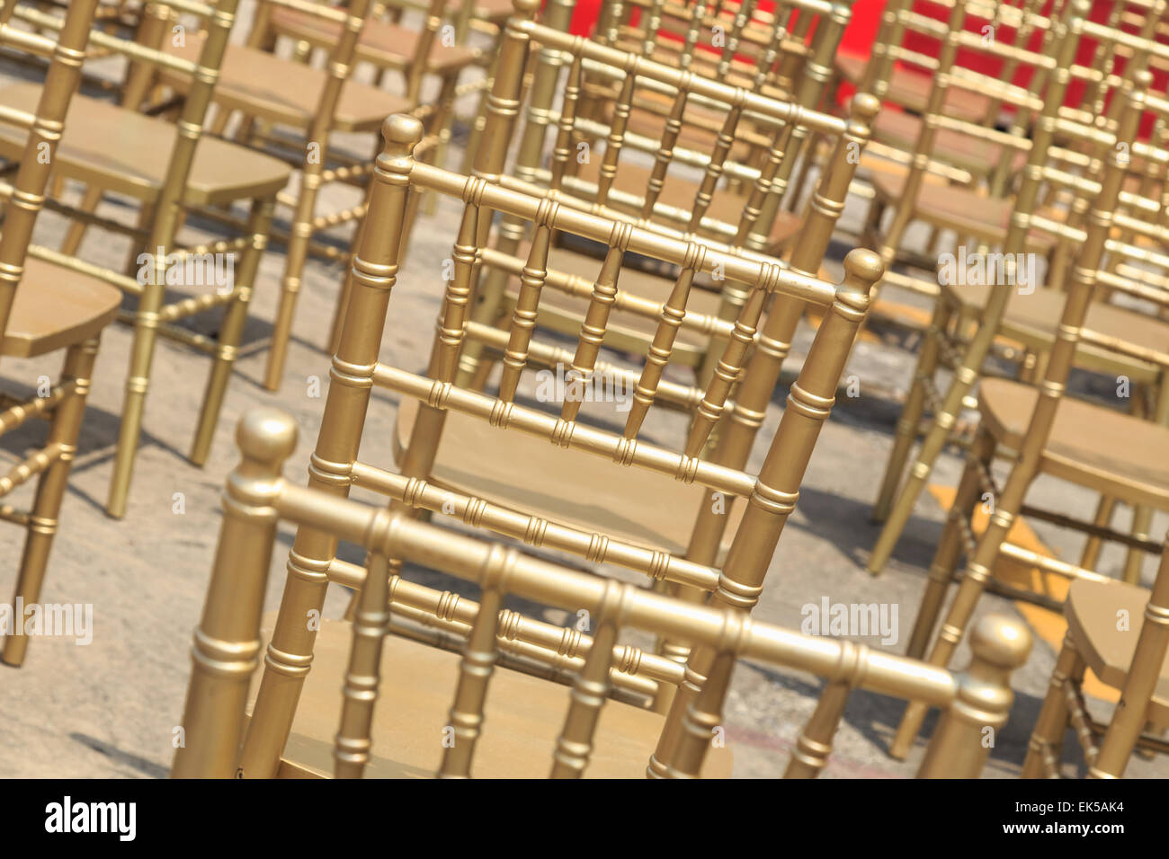 Close up Row of gold color chair Stock Photo - Alamy