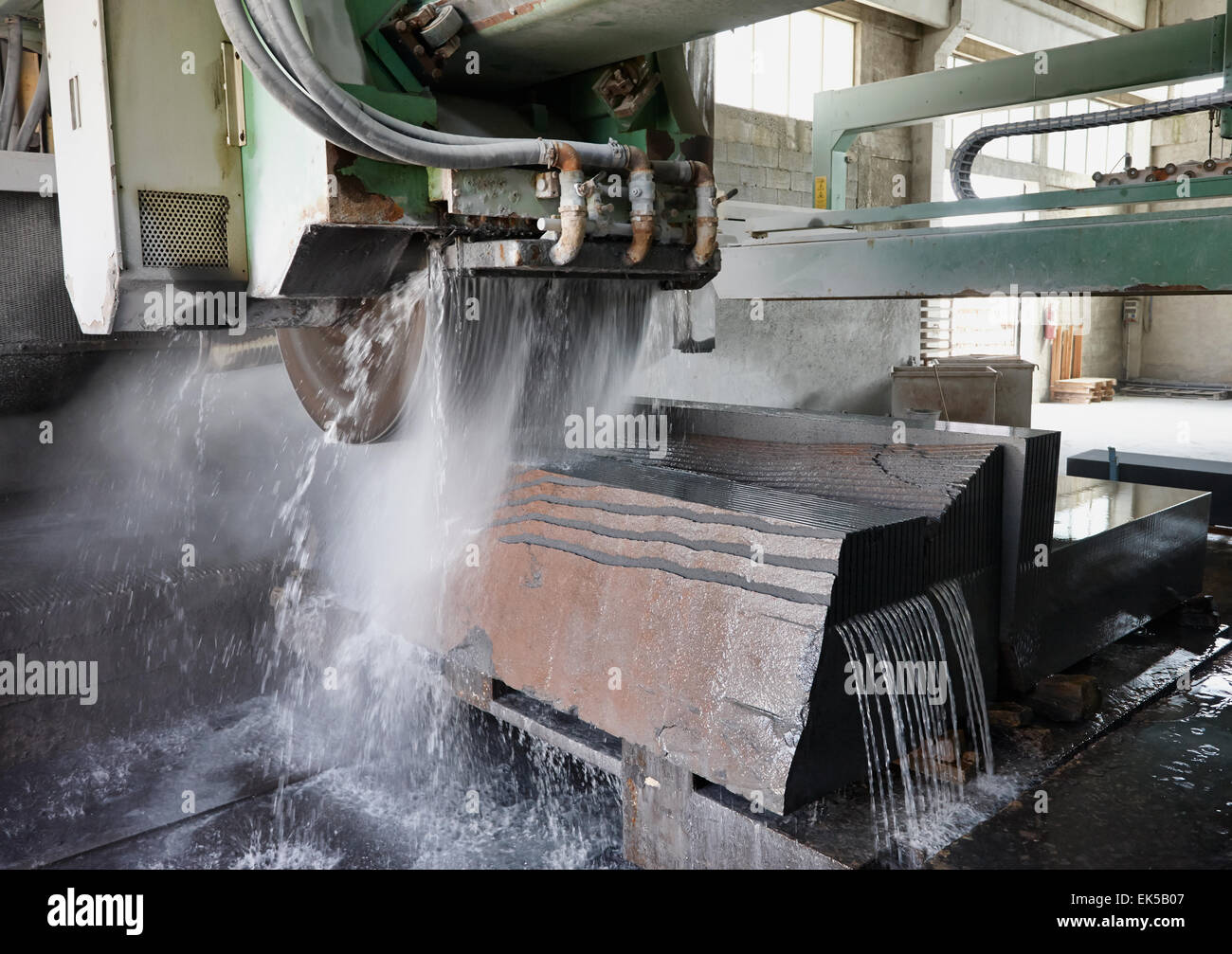 Italy, marble cutting factory, marble being cooled with water while cut ...