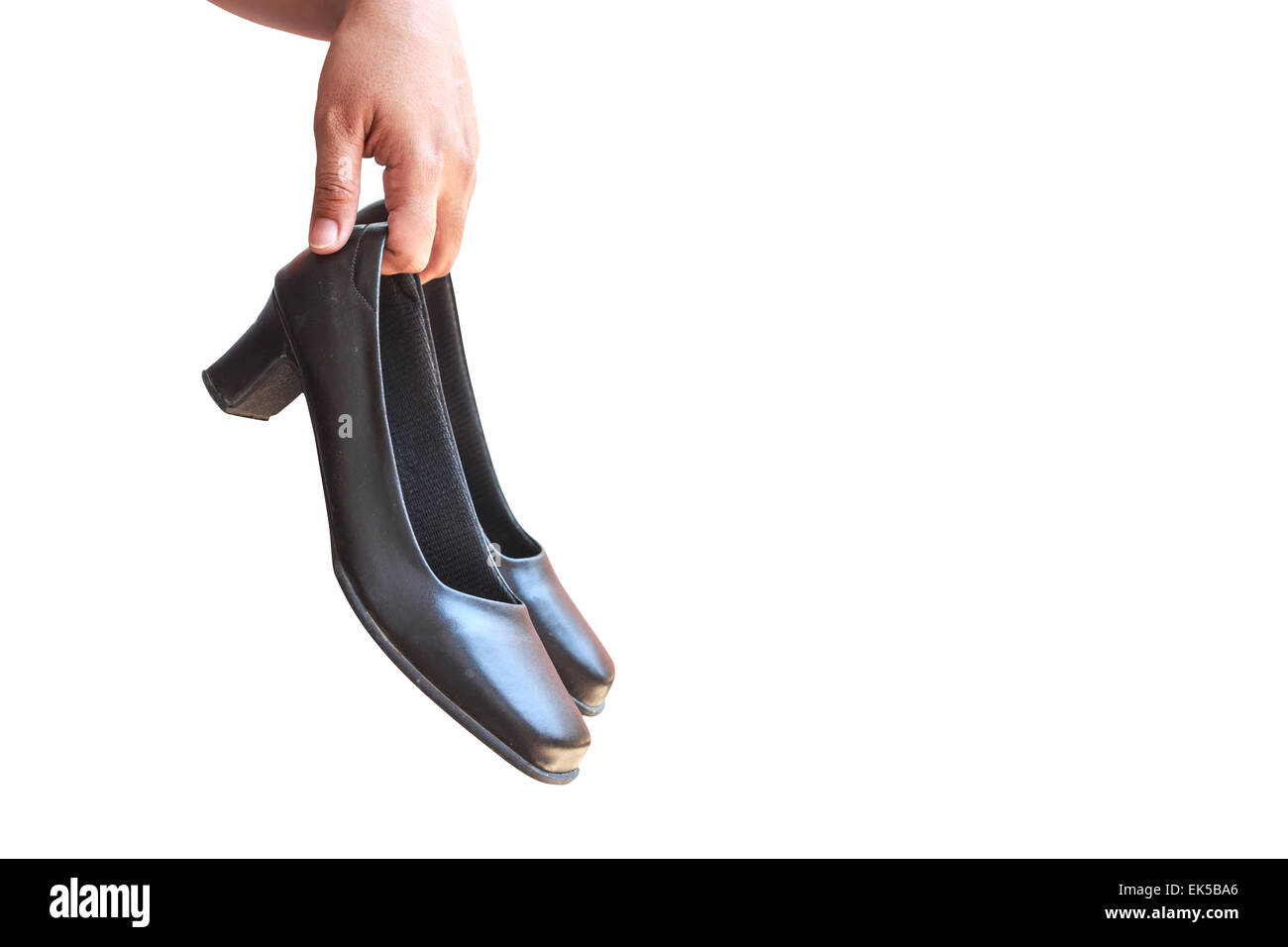Hand holding black shoe isolated on white background Stock Photo - Alamy