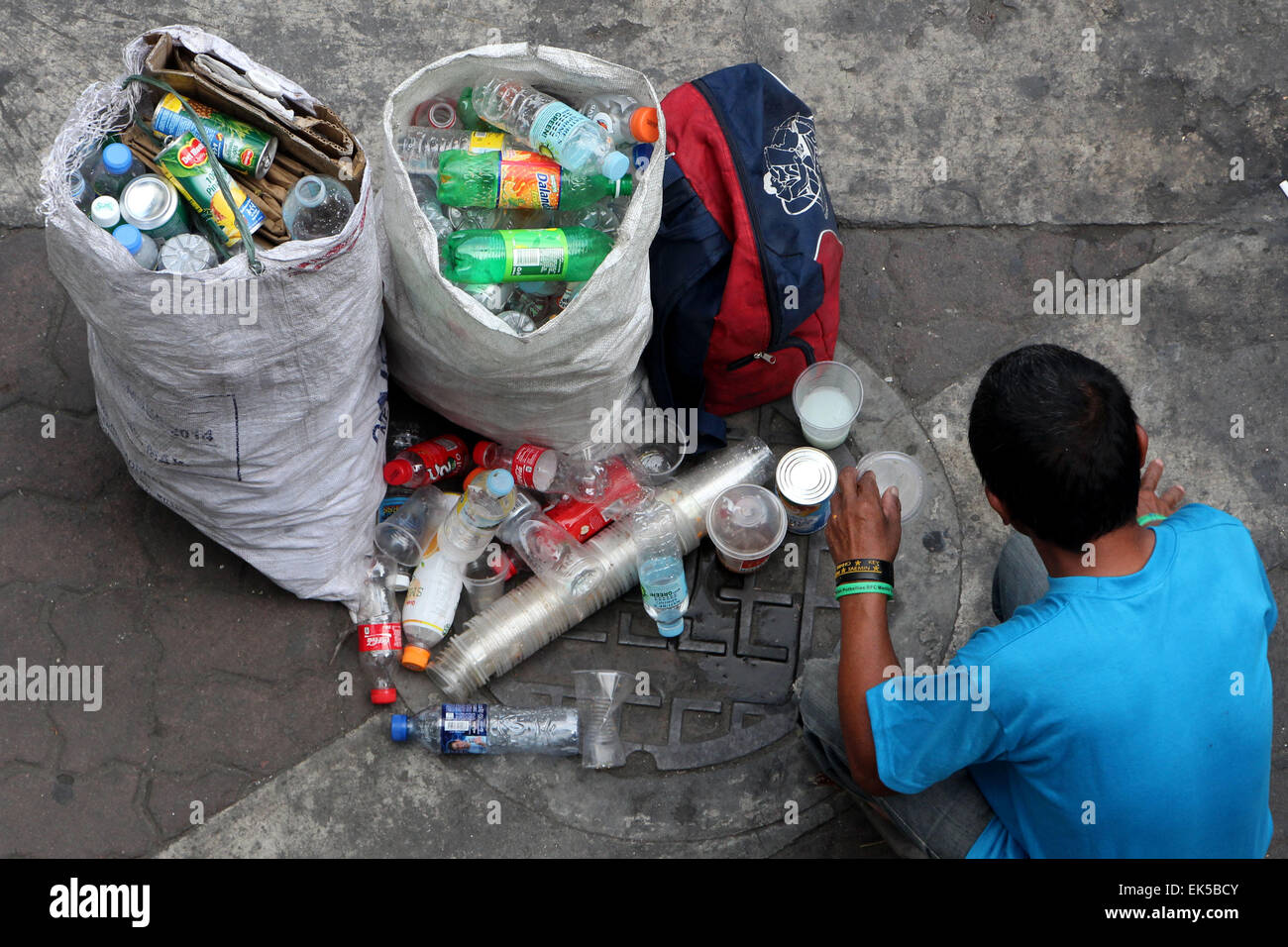 Manila, Philippines. 06th Apr, 2015. A scavengers collecting a plastic ...