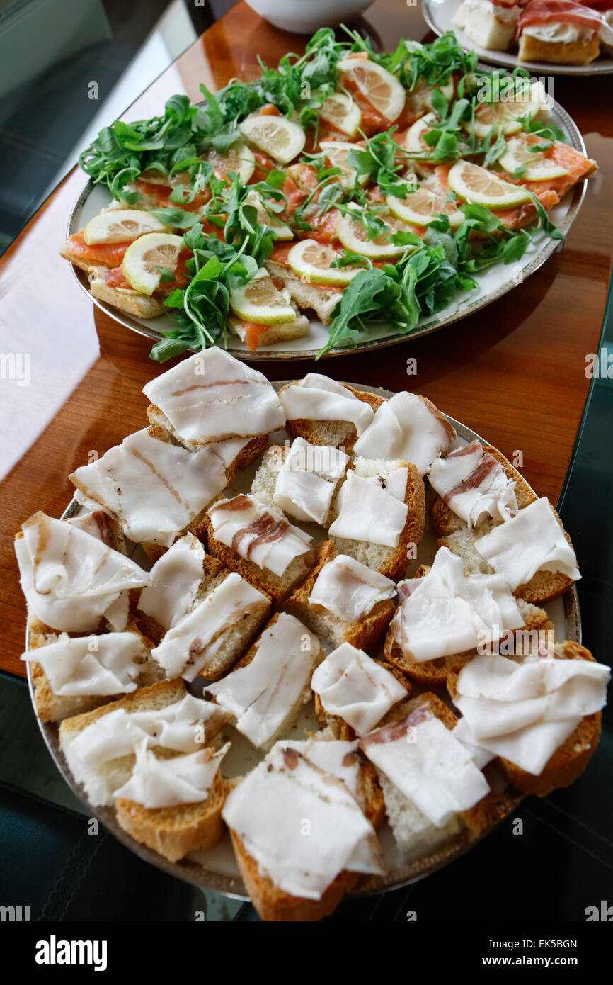 Italy, Elba island, various appetizers served with colonnata lard ...