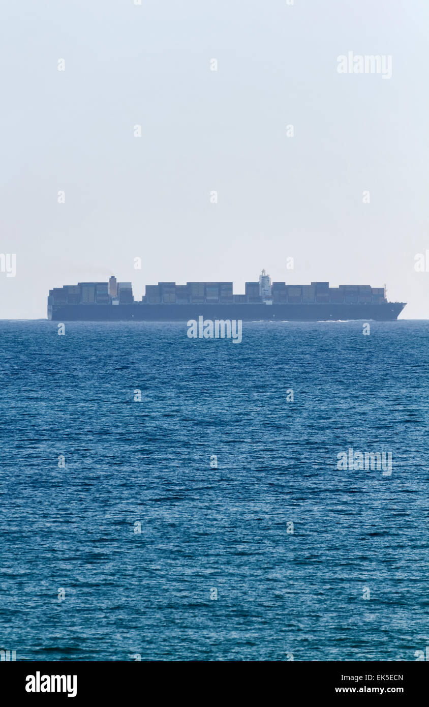 Italy, Sicily, Mediterranean sea, Cargo ship loaded with containers ...