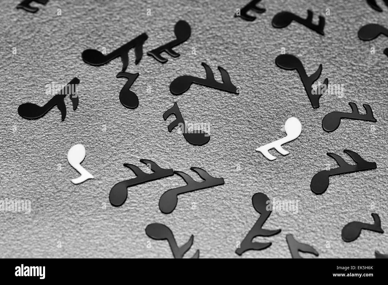 Musical notes on a flat grey surface Stock Photo - Alamy