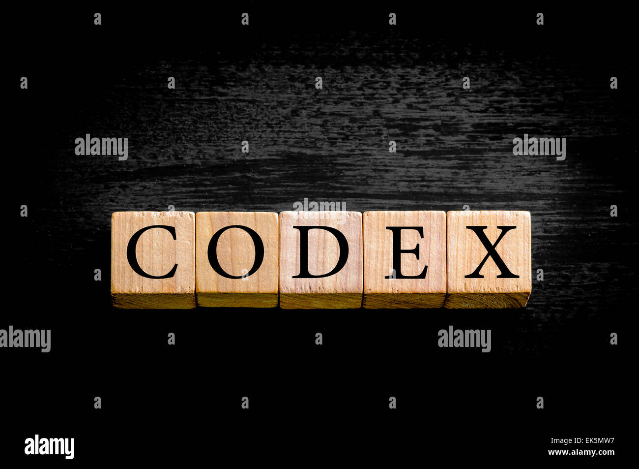 Word CODEX. Wooden small cubes with letters isolated on black ...