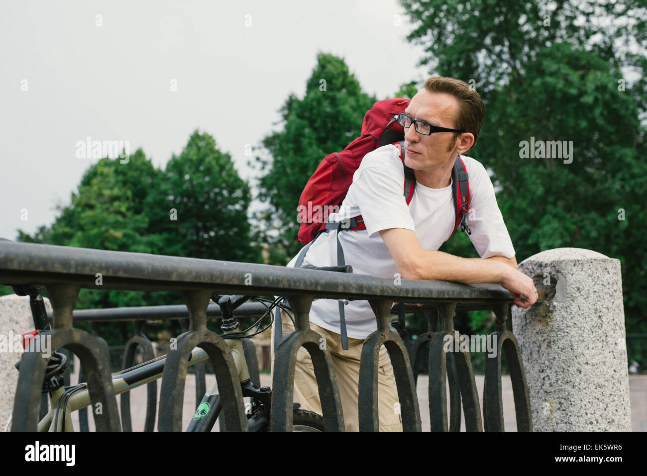 cyclist resting on the embankment Stock Photo - Alamy