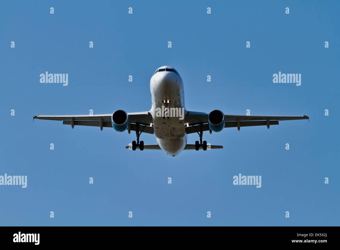 Italy, airplane flying in the sky Stock Photo - Alamy