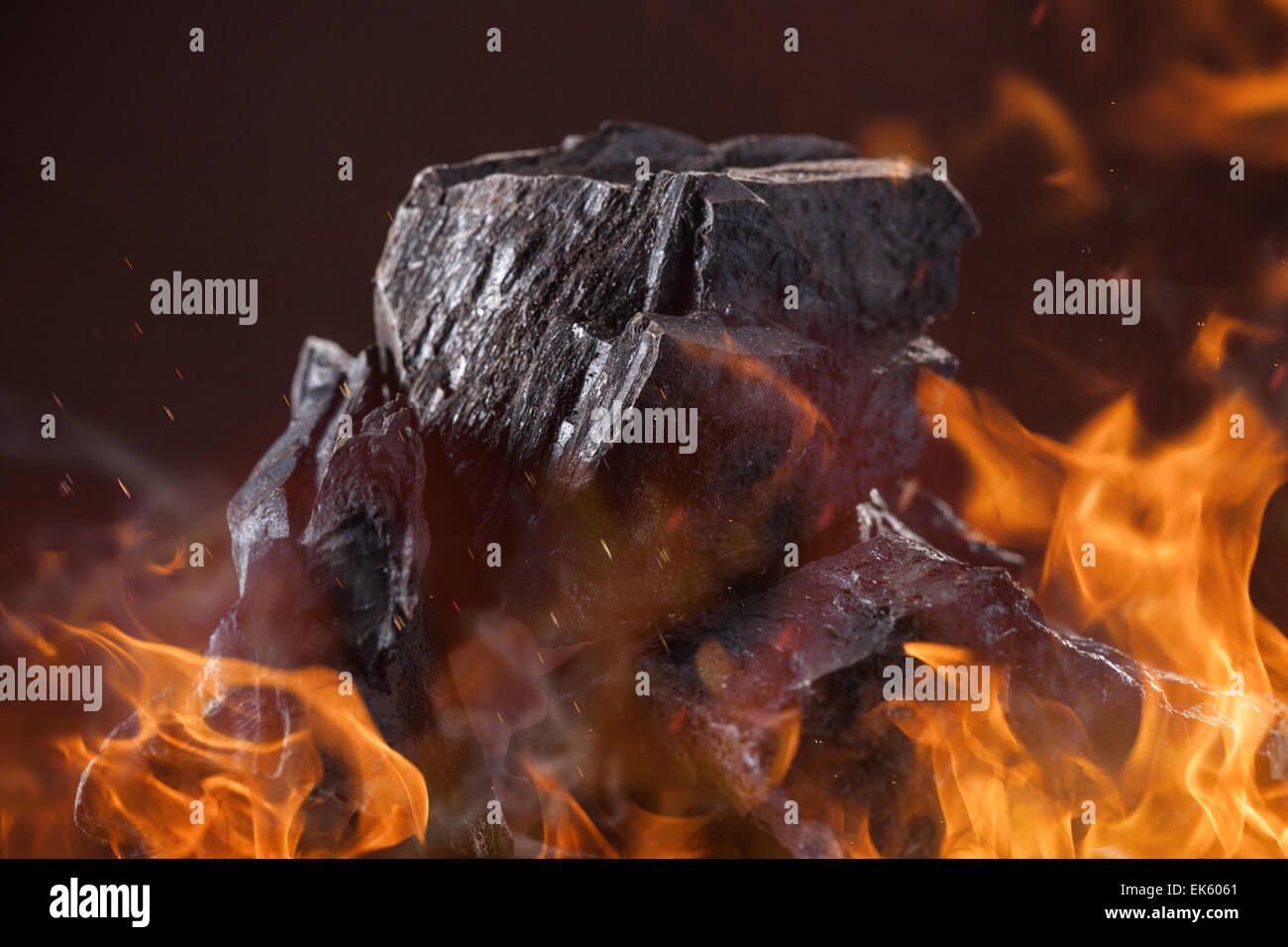 Coal lumps with fire flames, close-up Stock Photo - Alamy