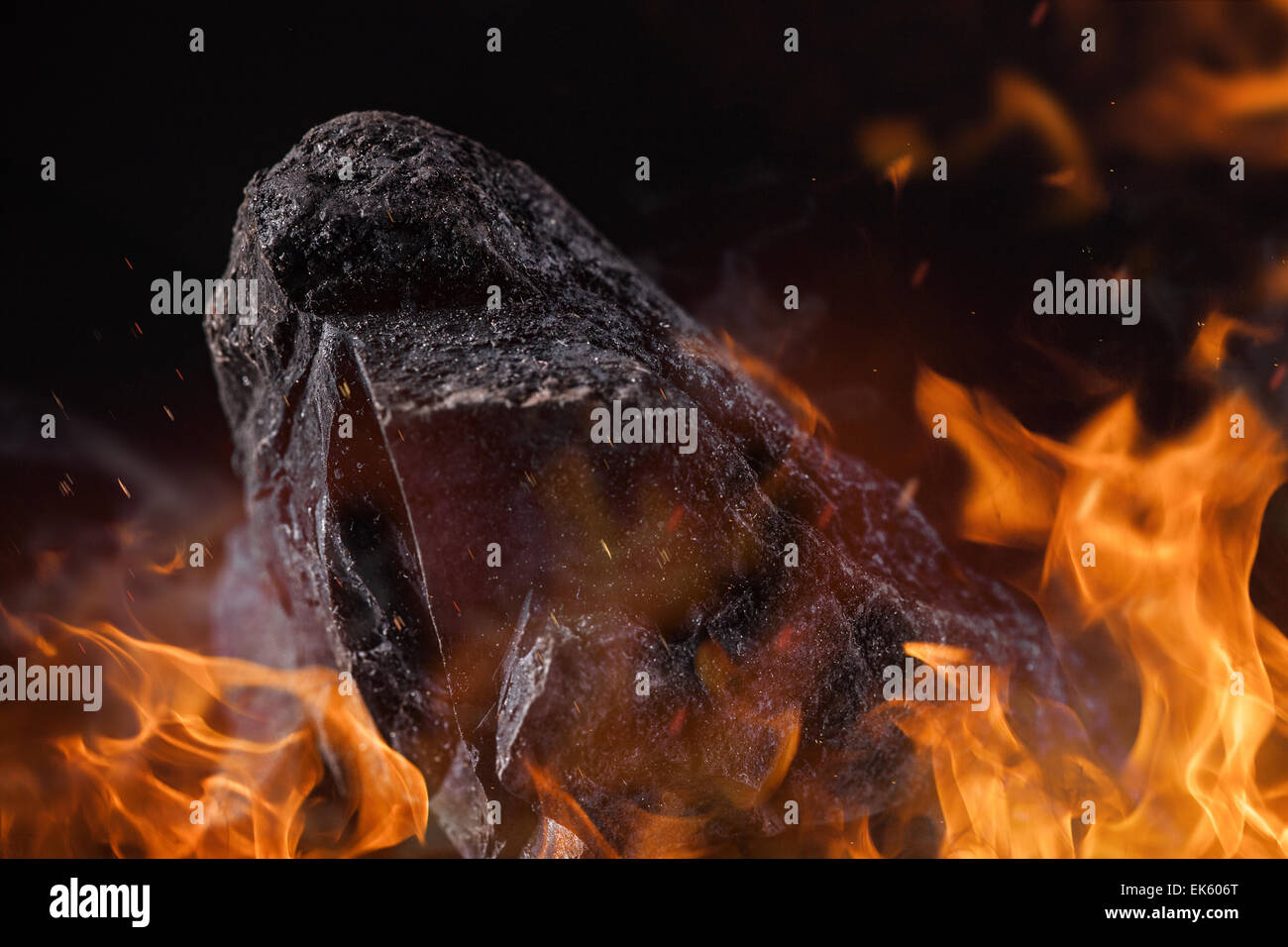 Coal lumps with fire flames, close-up Stock Photo - Alamy