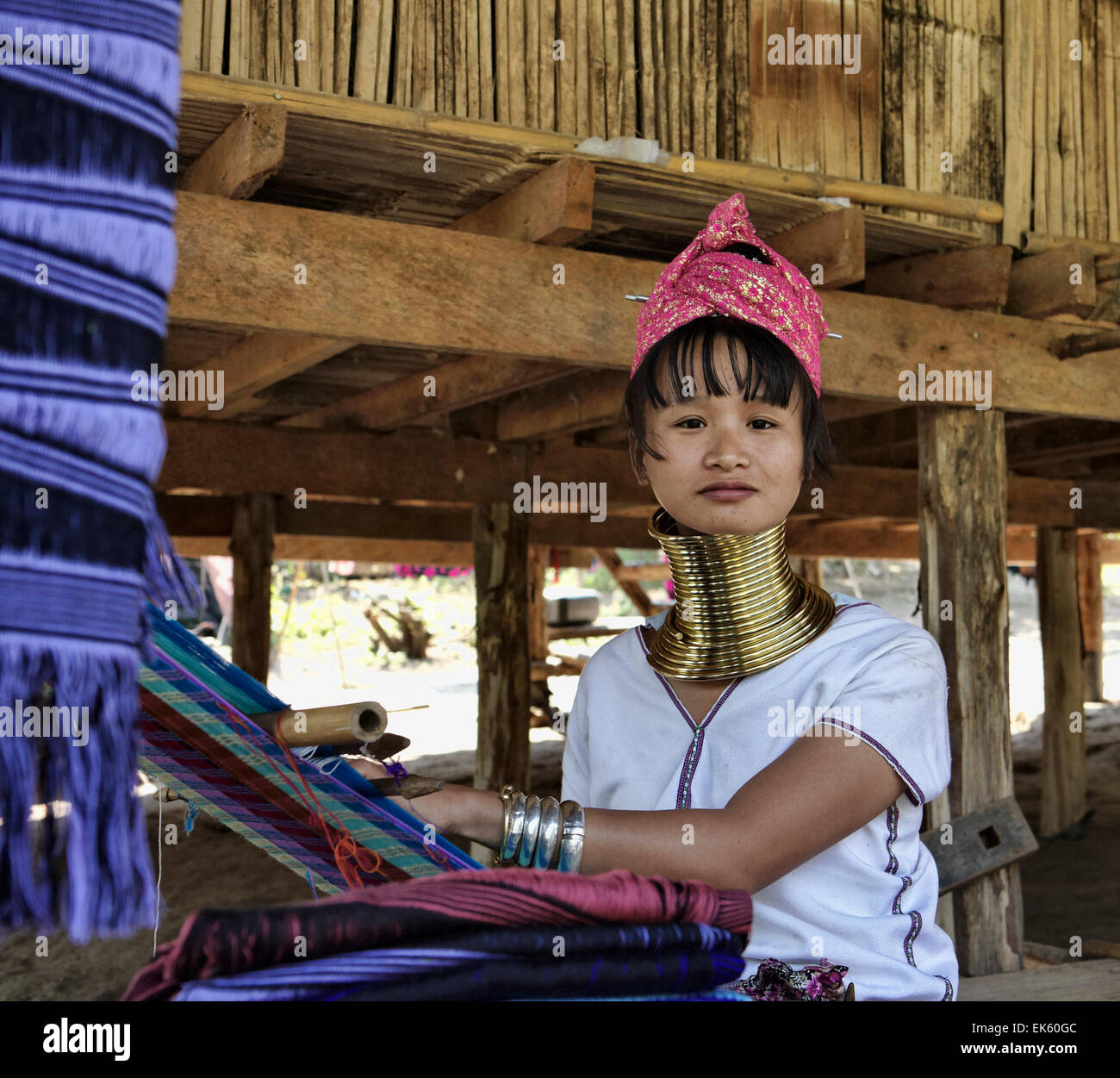 woman in traditional costumes. Women put brass rings on their neck when ...