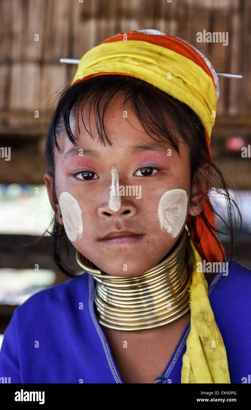 Thailand, Chang Mai, Karen Long Neck hill tribe village (Kayan Lahwi), young girl in traditional ...