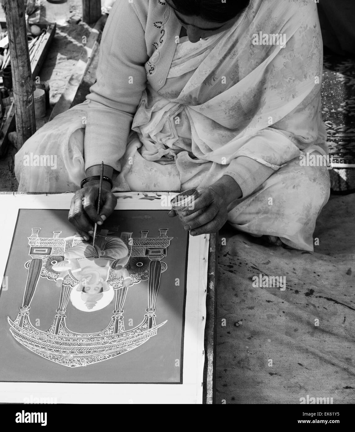 India, Rajasthan, Pushkar, indian woman painting an Hindu God drawing ...
