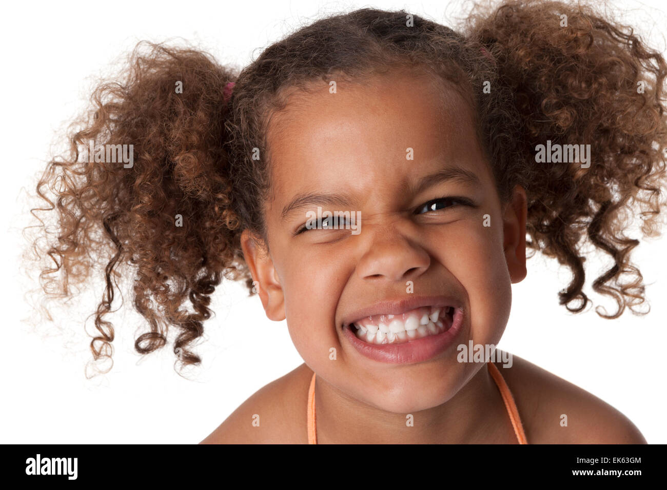 Portrait of a five year old girl making faces on white background Stock ...