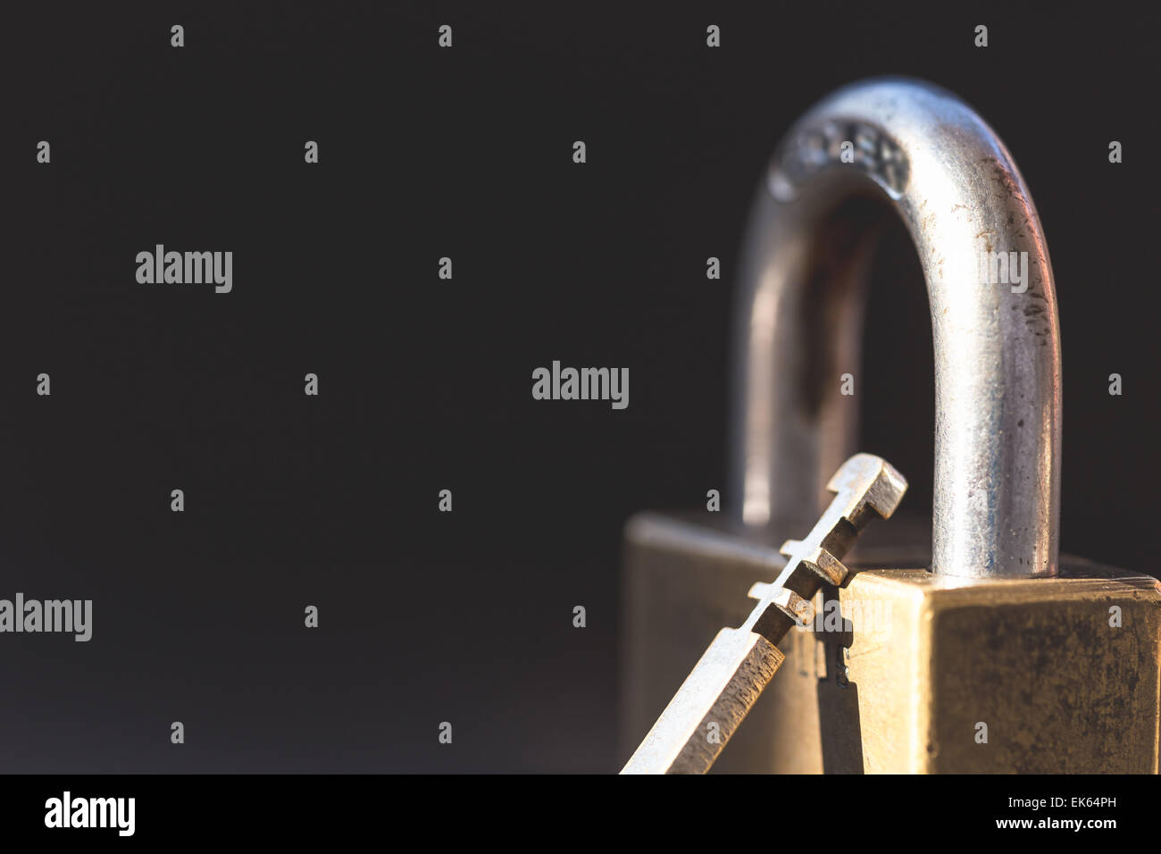 Close up Lock with key on black background Stock Photo - Alamy