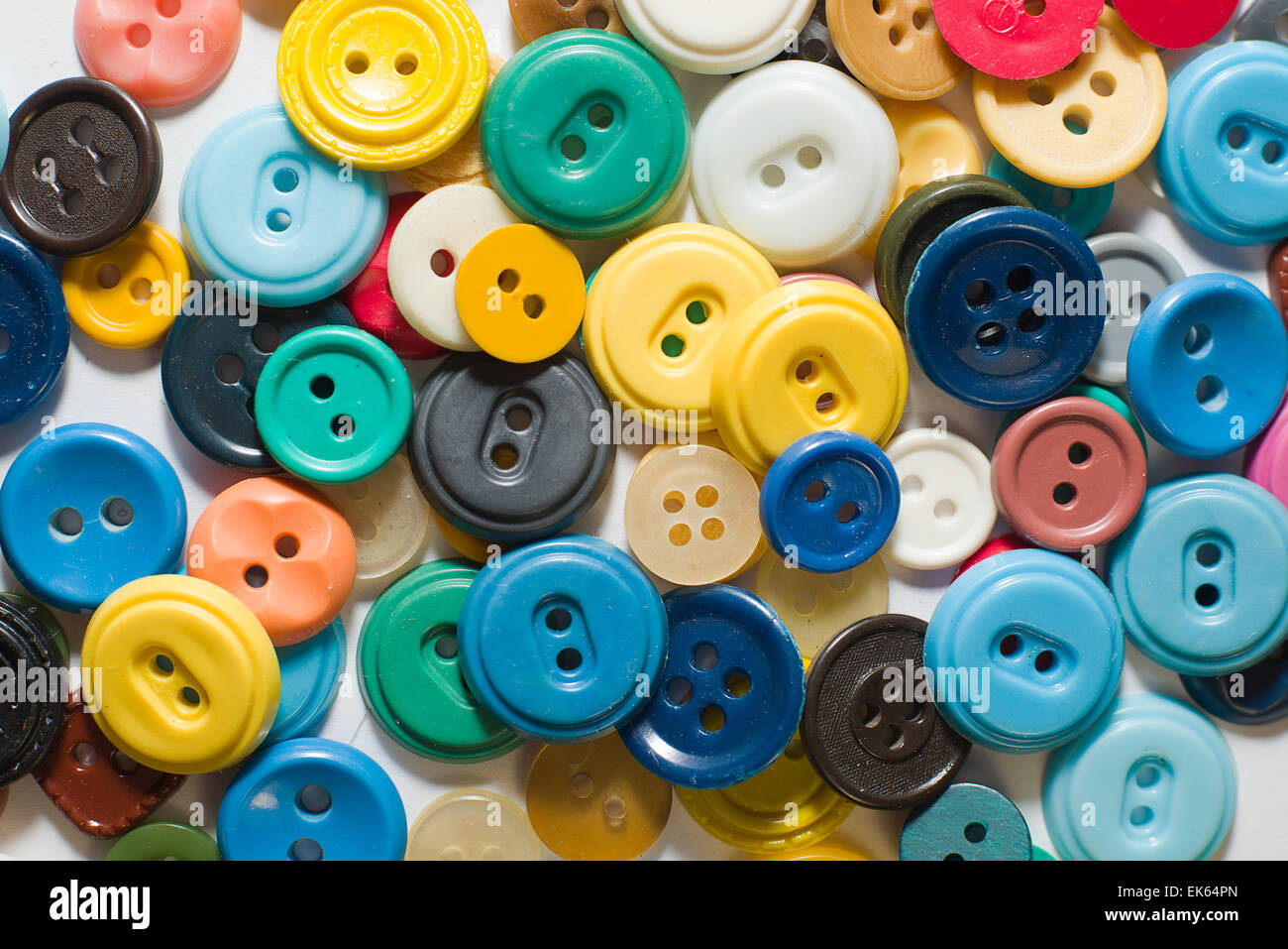 A lot of old buttons on a white background Stock Photo - Alamy