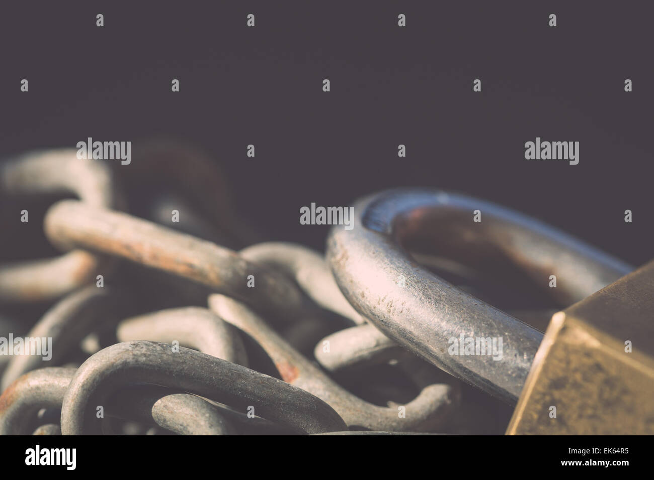 Macro old lock and rusty chain on black background Stock Photo - Alamy