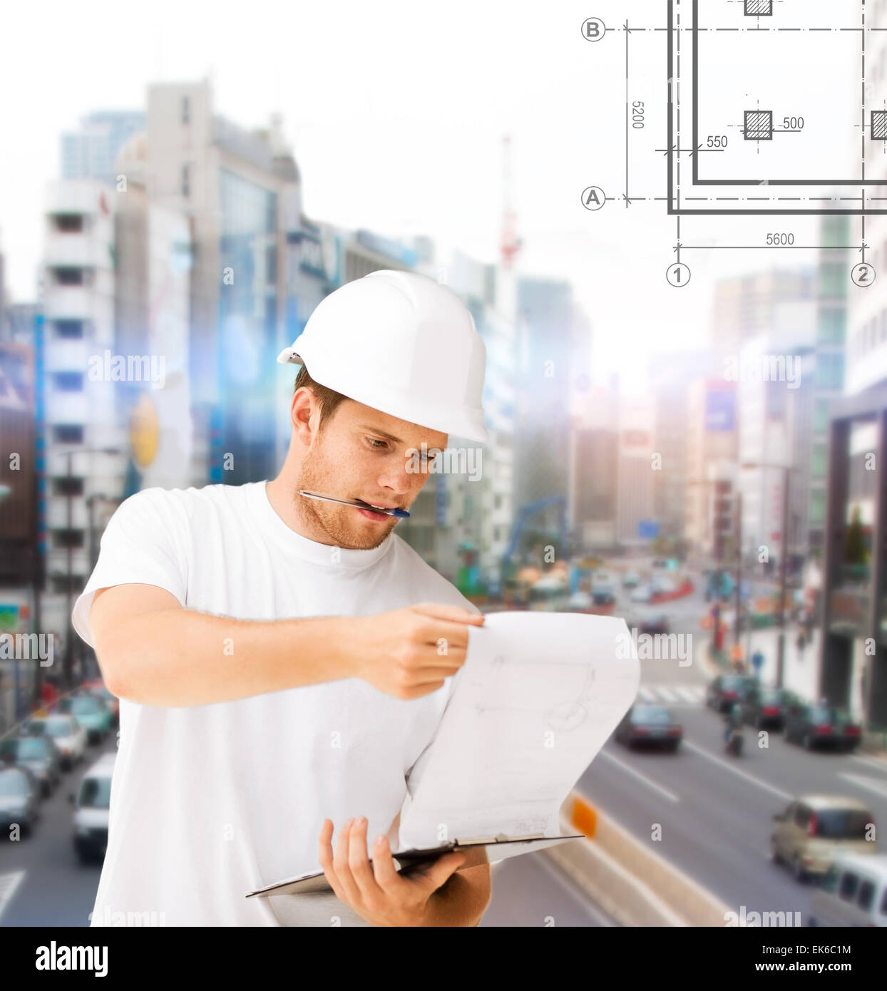 male architect looking at blueprint Stock Photo - Alamy