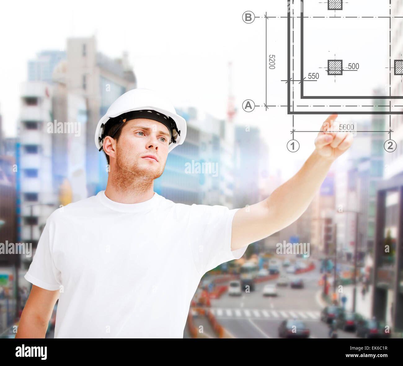 male architect pointing to blueprint Stock Photo - Alamy