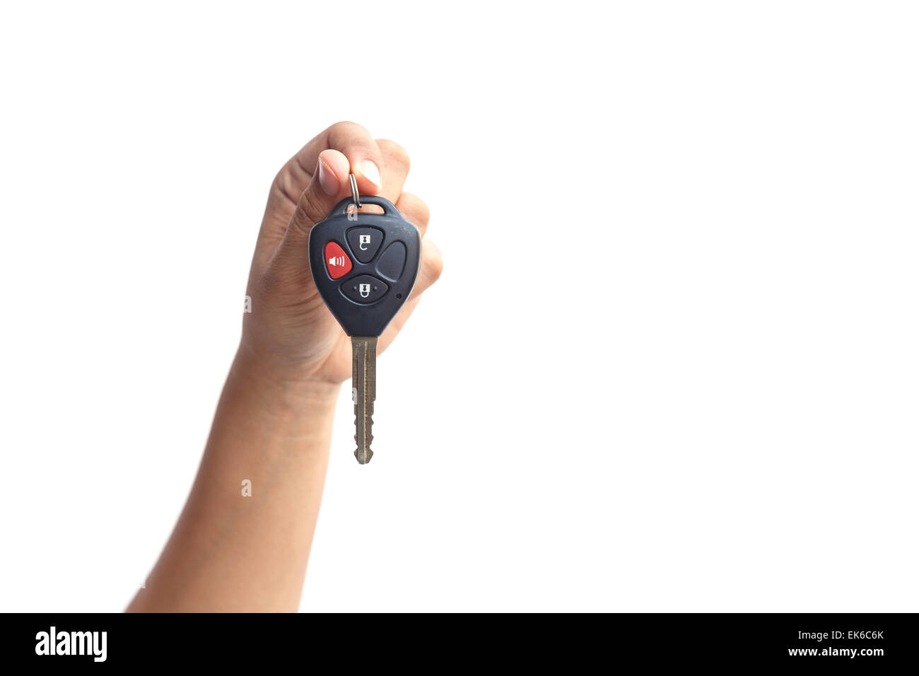 Hand holding car key isolated on white background Stock Photo - Alamy